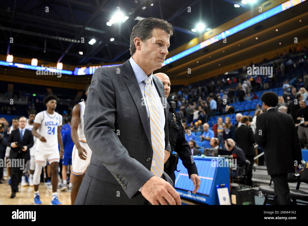 UCLA head coach Steve Alford leaves the court after beating ...
