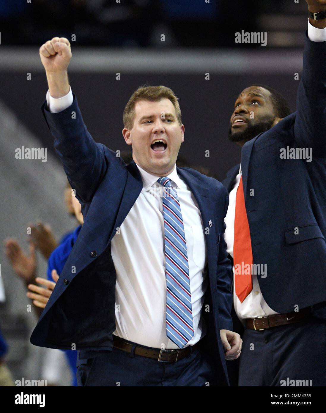 Presbyterian head coach Dustin Kerns, left, signals instructions to his ...