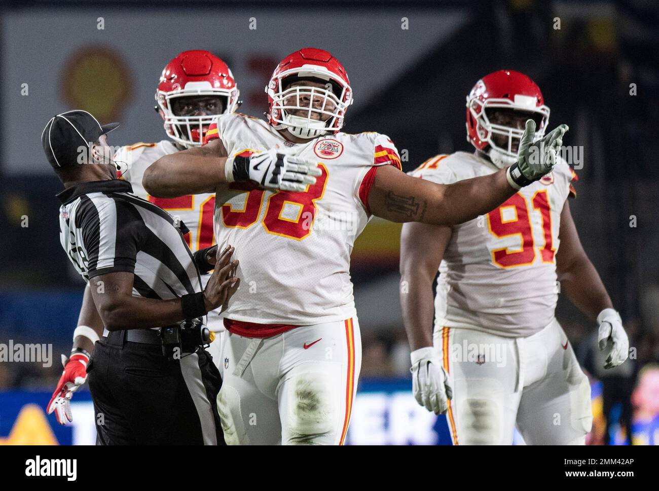Kansas City Chiefs nose tackle Xavier Williams, center, celebrates his ...
