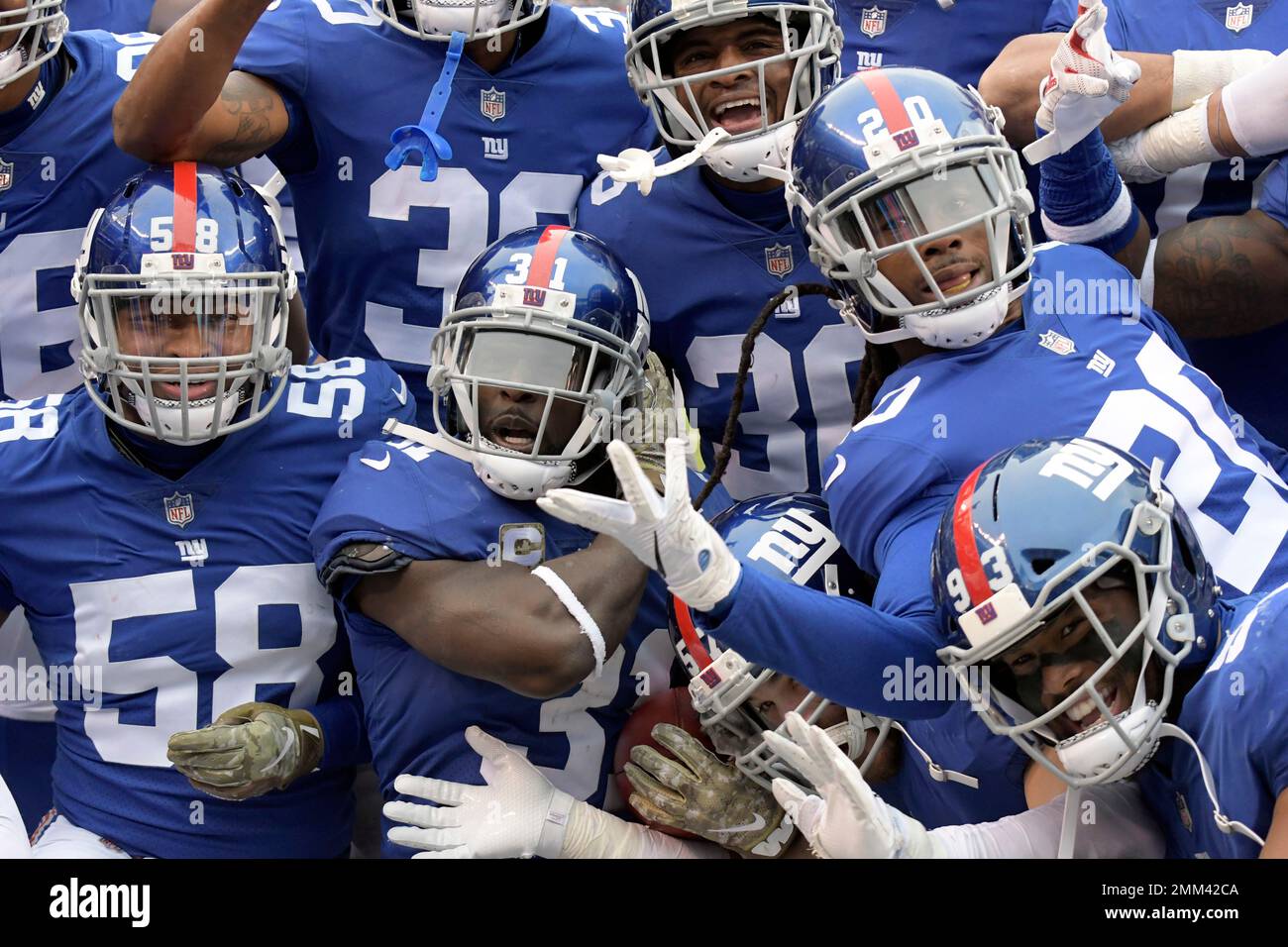 New York Giants' Michael Thomas, center, celebrates an interception ...