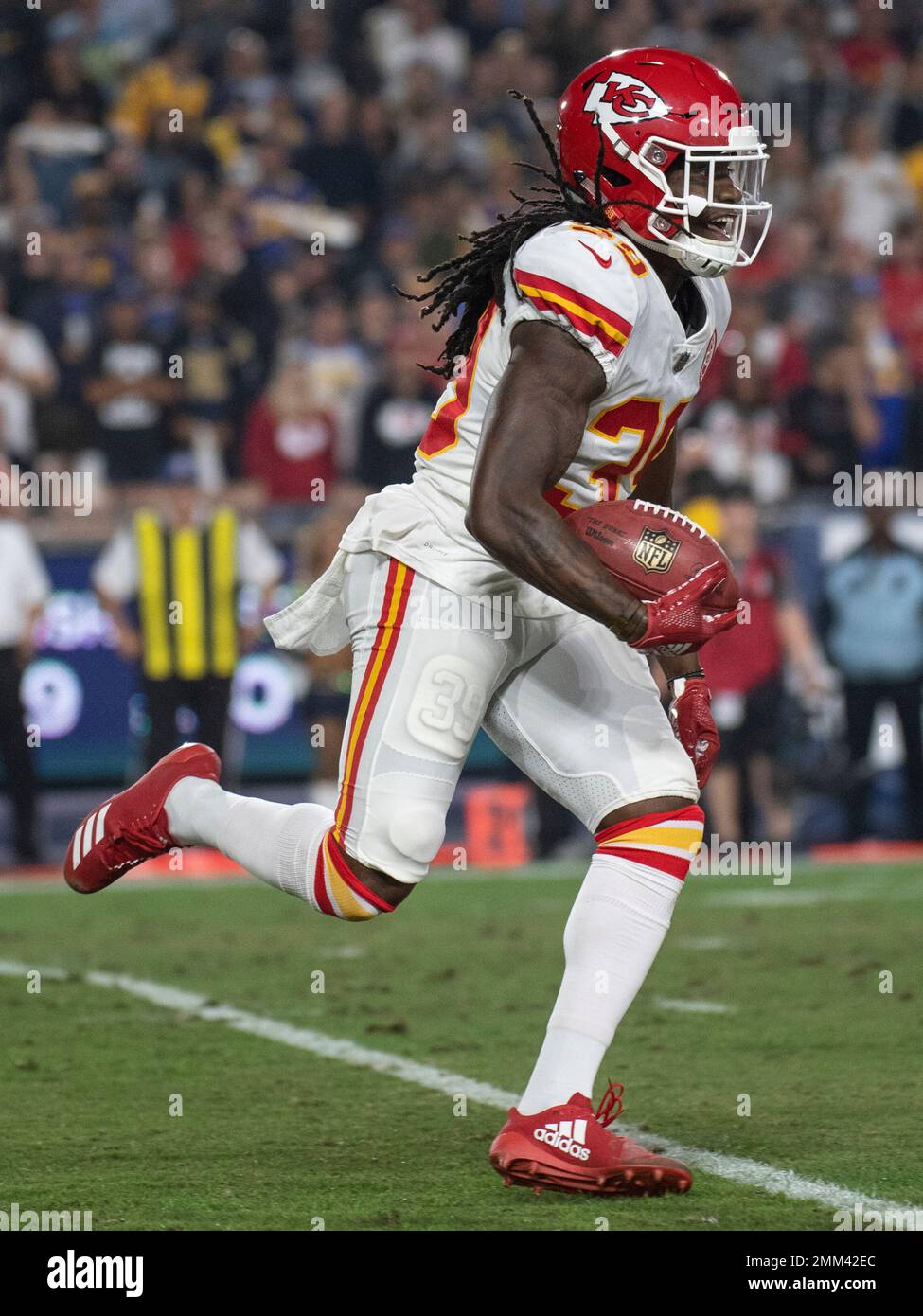 Kansas City Chiefs defensive back Tremon Smith sprints with the ball ...