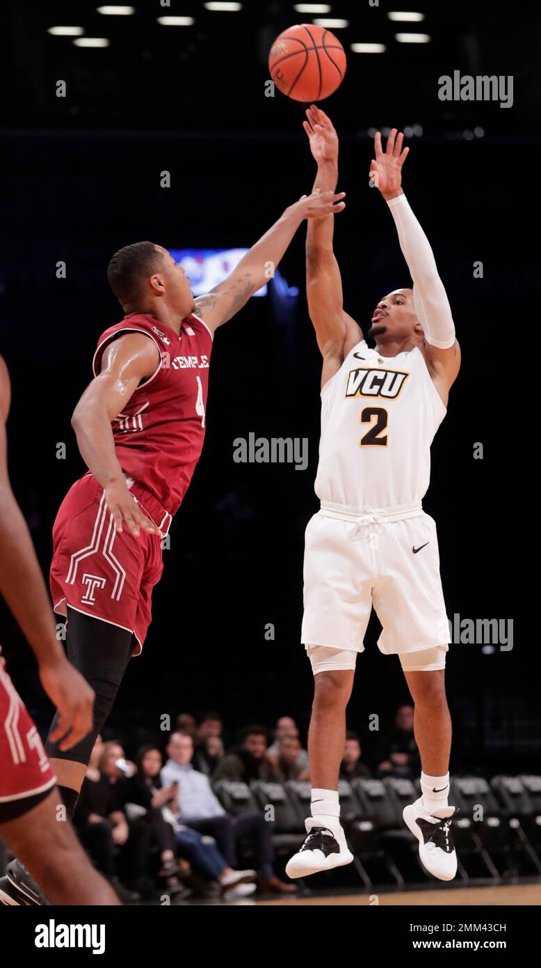 Virginia Commonwealth's Marcus Evans (2) shoots over Temple's J.P ...
