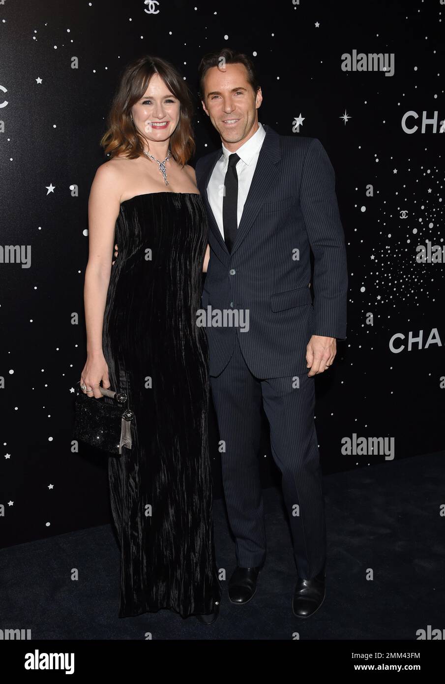 Actors Emily Mortimer, left, and husband Alessandro Nivola attend the ...