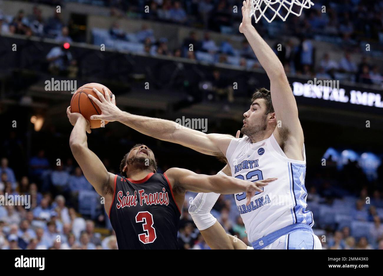 North Carolina forward Luke Maye (32) blocks St. Francis guard Jamaal ...