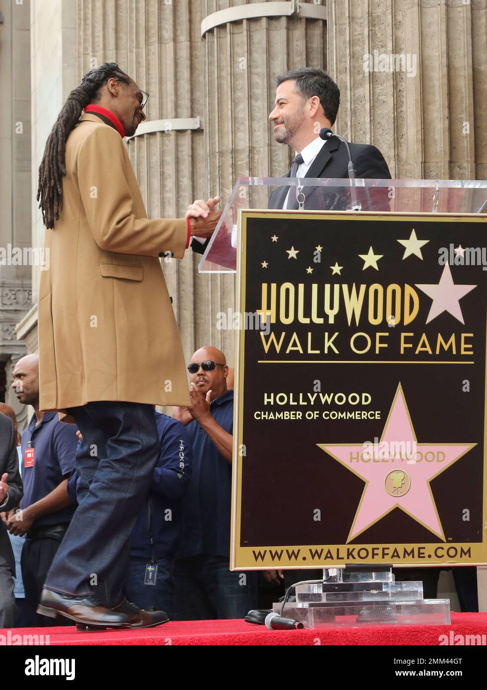 Honoree rapper Snoop Dogg, left, shakes comedian Jimmy Kimmel's hand ...