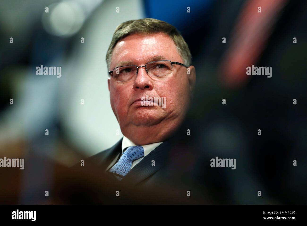 Carl Blesch, Weld County, Colo., coroner, looks on during a news ...