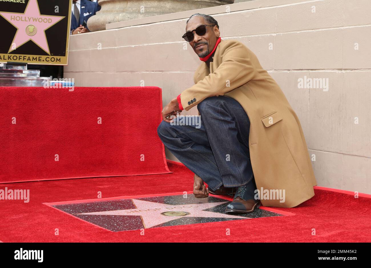 Rapper Snoop Dogg poses atop his new star on the Hollywood Walk of Fame ...