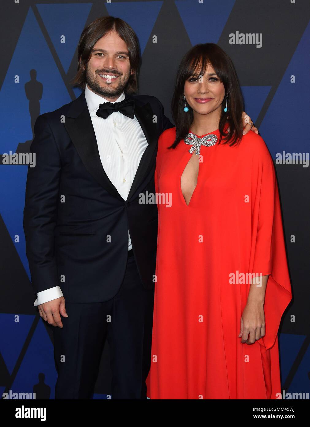 Alan Hicks, left, and Rashida Jones arrive at the Governors Awards on ...