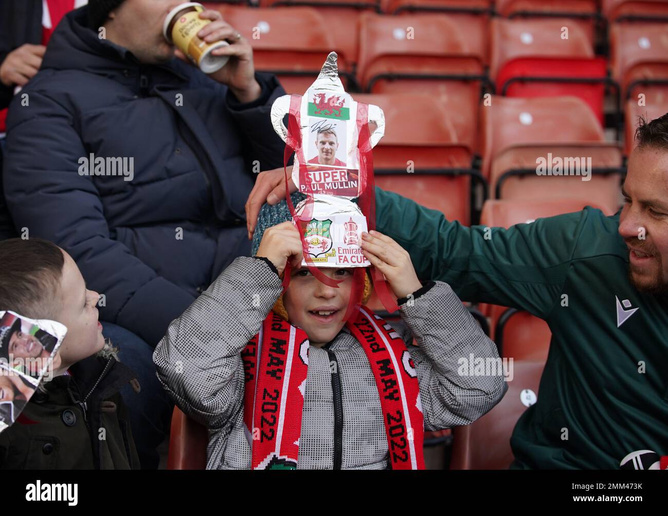 A young Wrexham fan with a tin foil replica trophy in the stands before ...