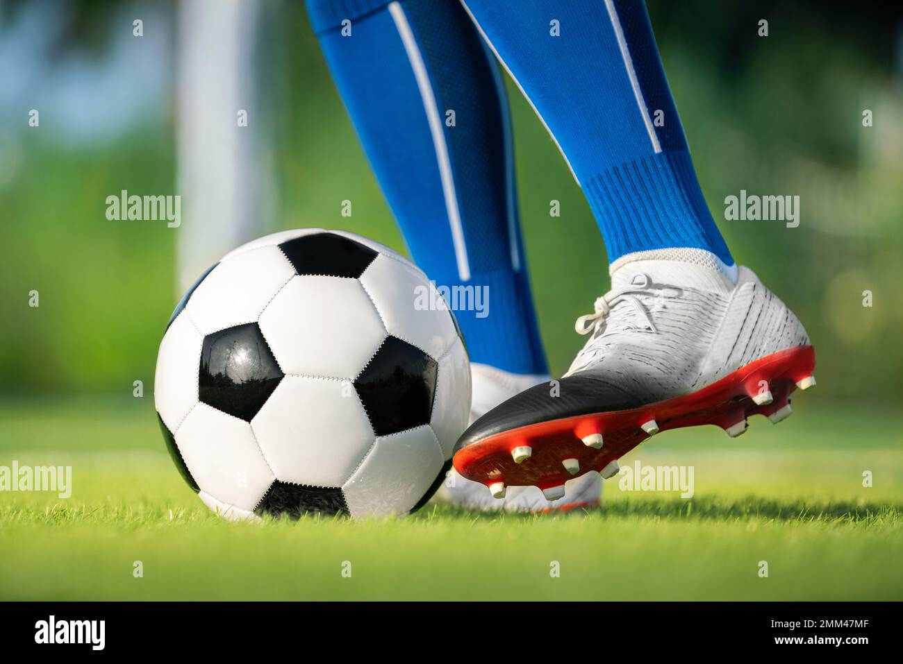 football player set ball football on grass at freekick point before ...