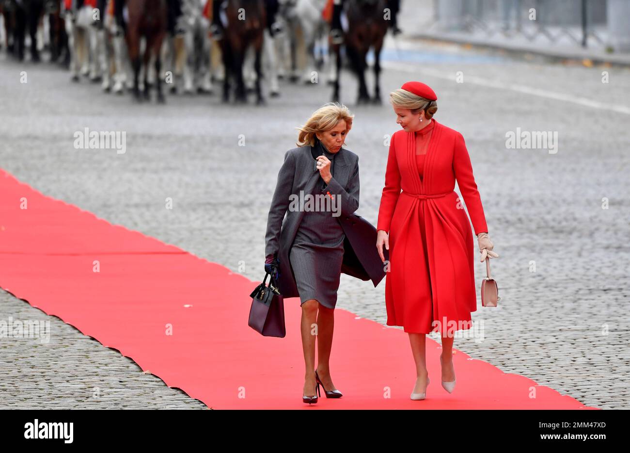 Belgian Queen Mathilde, right, speaks with French first lady Brigitte ...