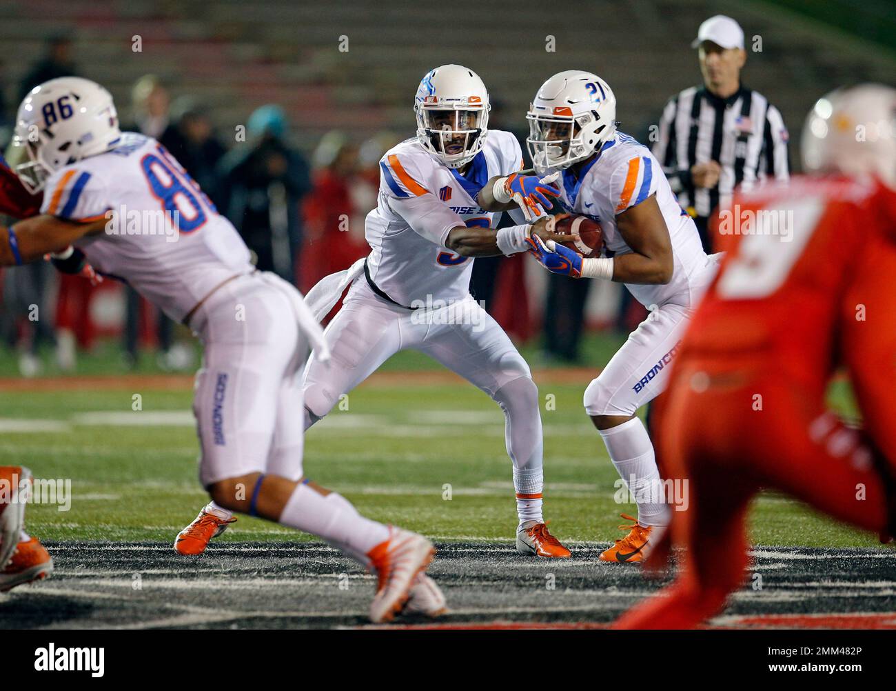Boise State quarterback Jaylon Henderson (9) feints handing the ball to ...