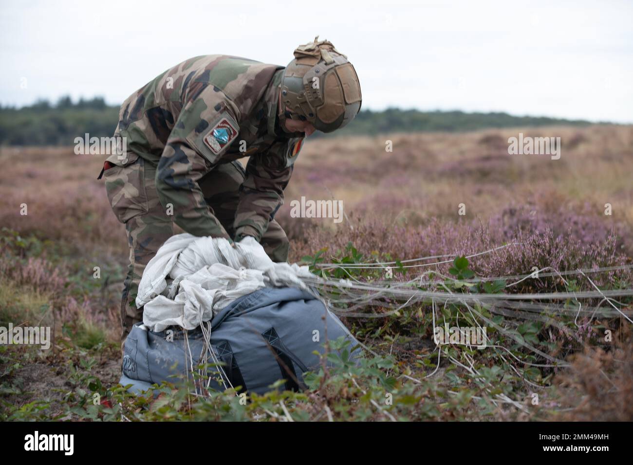 A French Paratrooper derigs his Polish parachute after landing on the ...