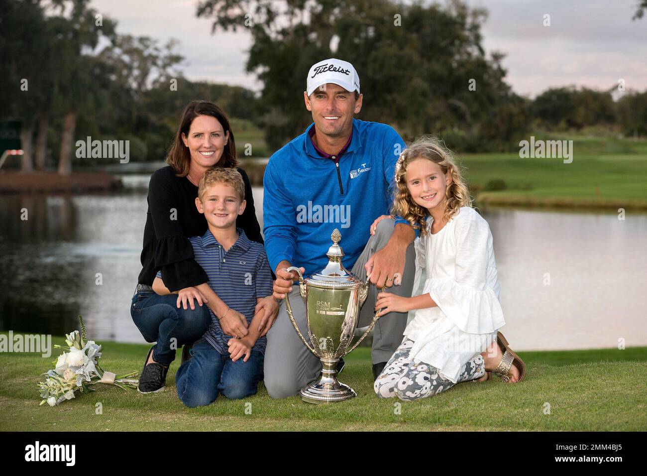 Charles Howell III, center, is joined by his wife Heather and their ...