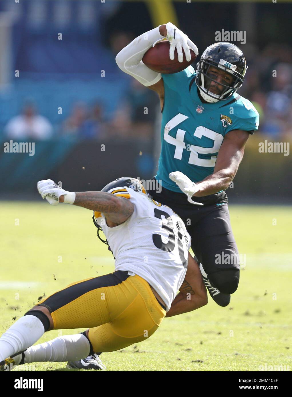 Jacksonville Jaguars strong safety Barry Church (42) is stopped by ...