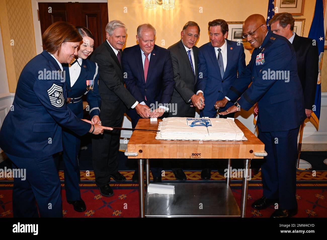 Senior Air Force leaders and congressmen cut the cake during the Air ...