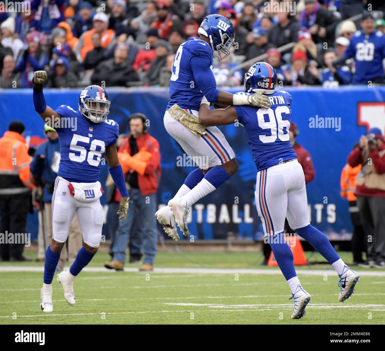 New York Giants' Tae Davis, left, Lorenzo Carter, center, and Kareem ...