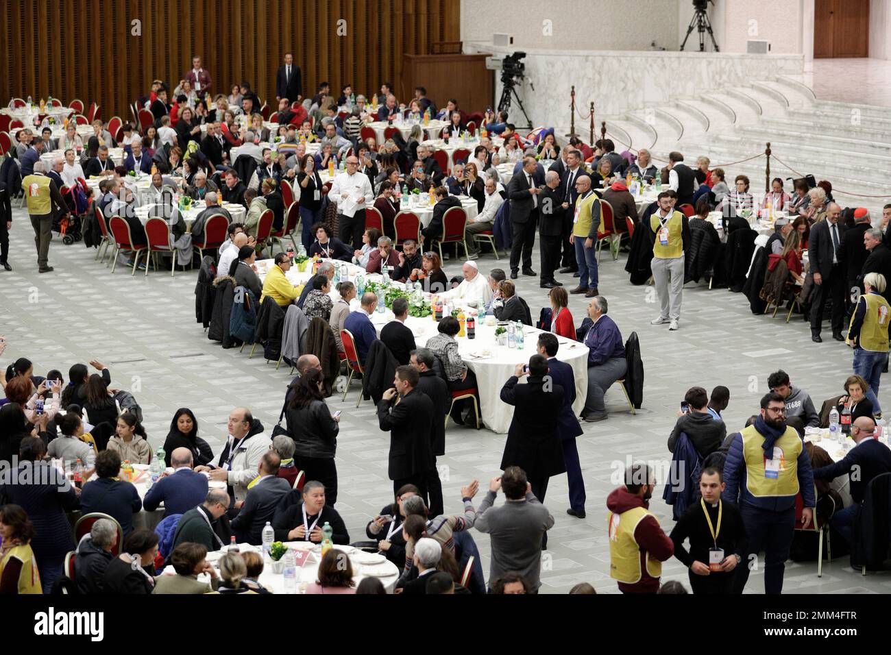 Pope Francis sits at a table during a lunch, at the Vatican, Sunday ...