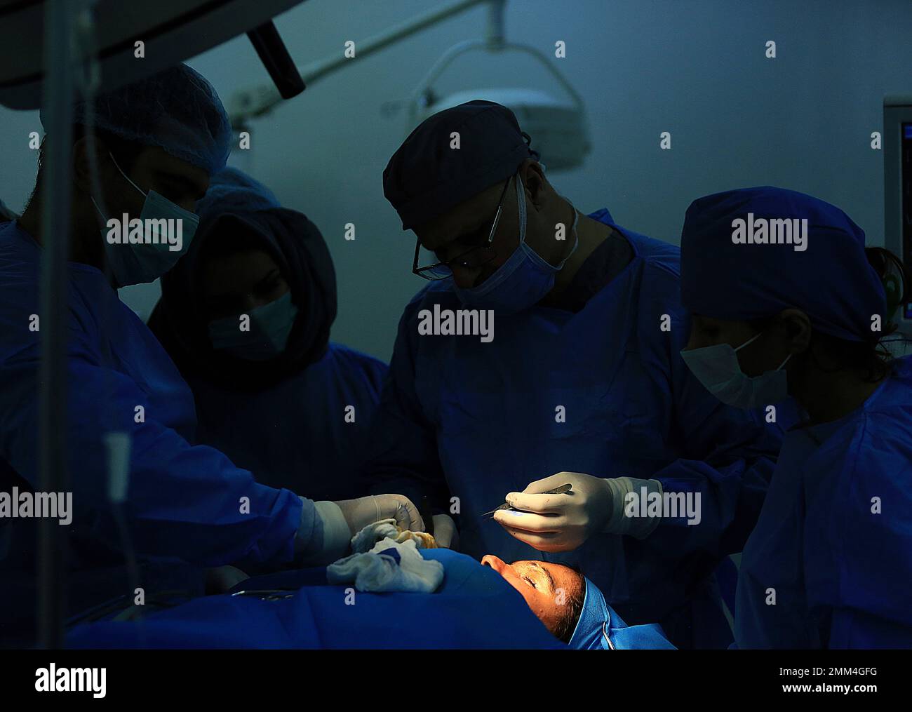 In this Tuesday, Nov. 6, 2018 photo, plastic surgeon Dr. Abbas al-Sahan ...