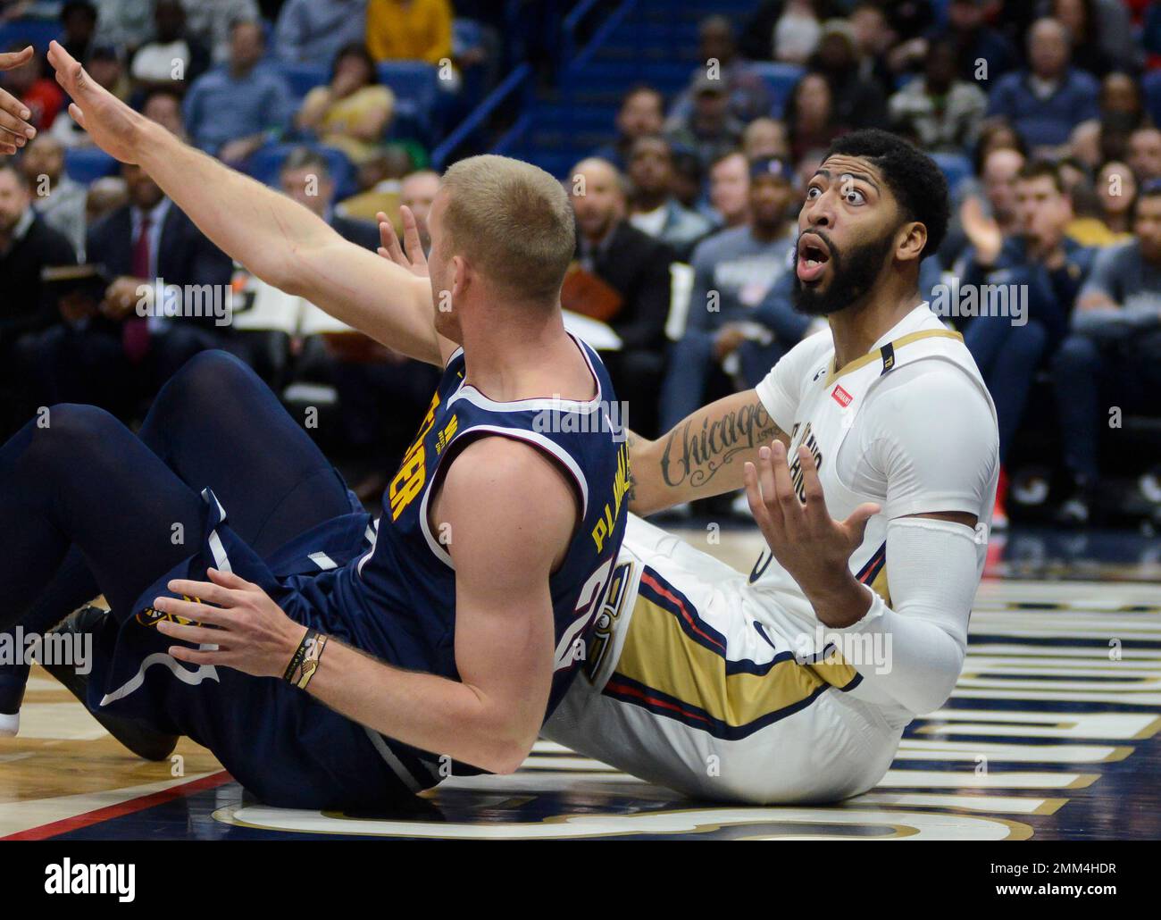 New Orleans Pelicans forward Anthony Davis, right, questions a foul ...