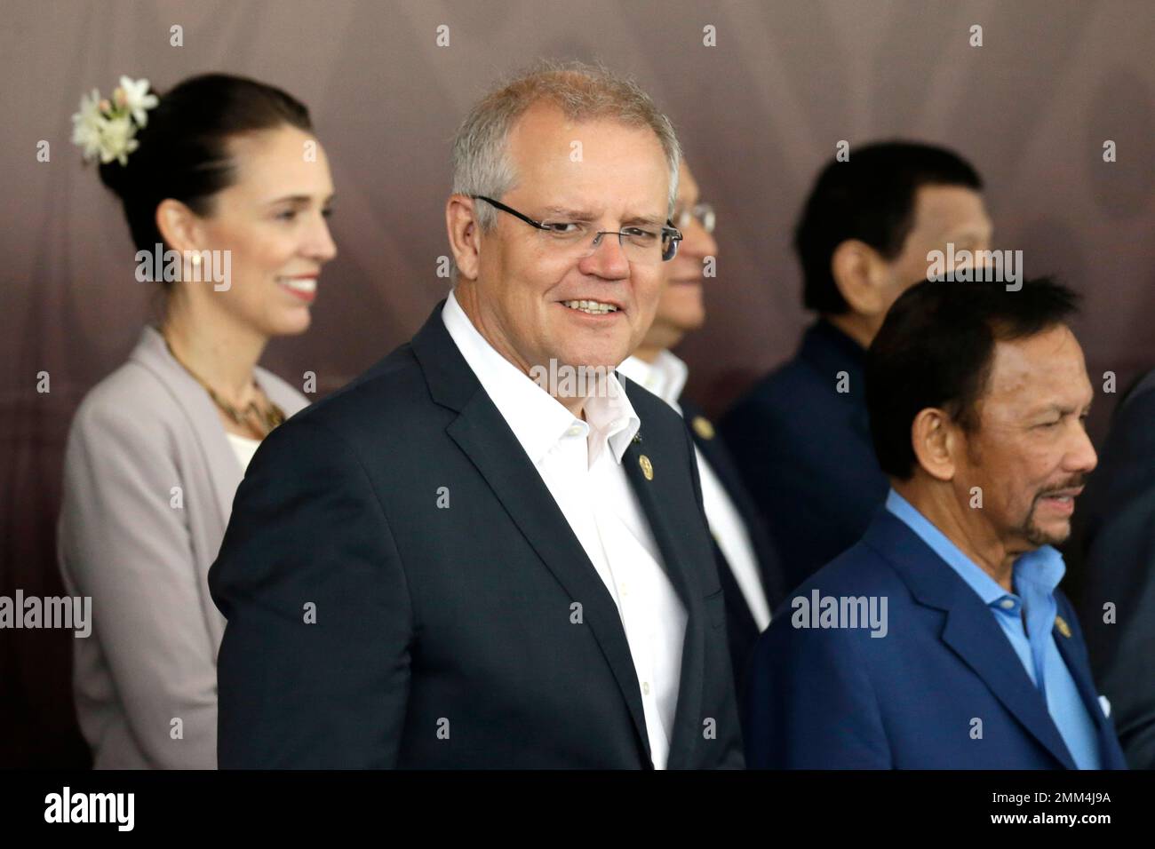 Australia's Prime Minister Scott Morrison, center, poses for a group ...