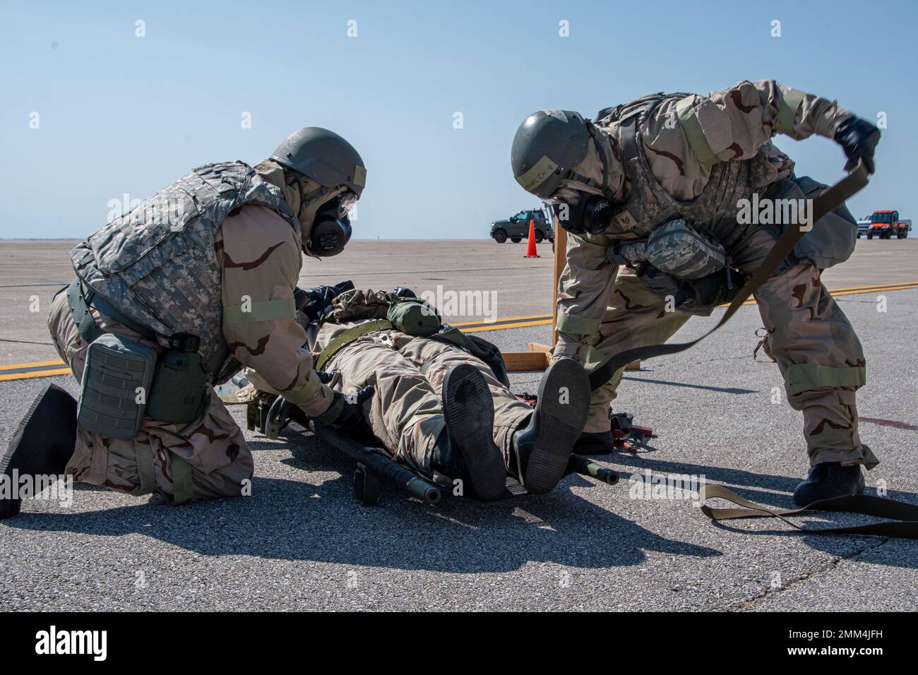 U.S. Air Force Airmen secure a simulated casualty on a litter during a ...