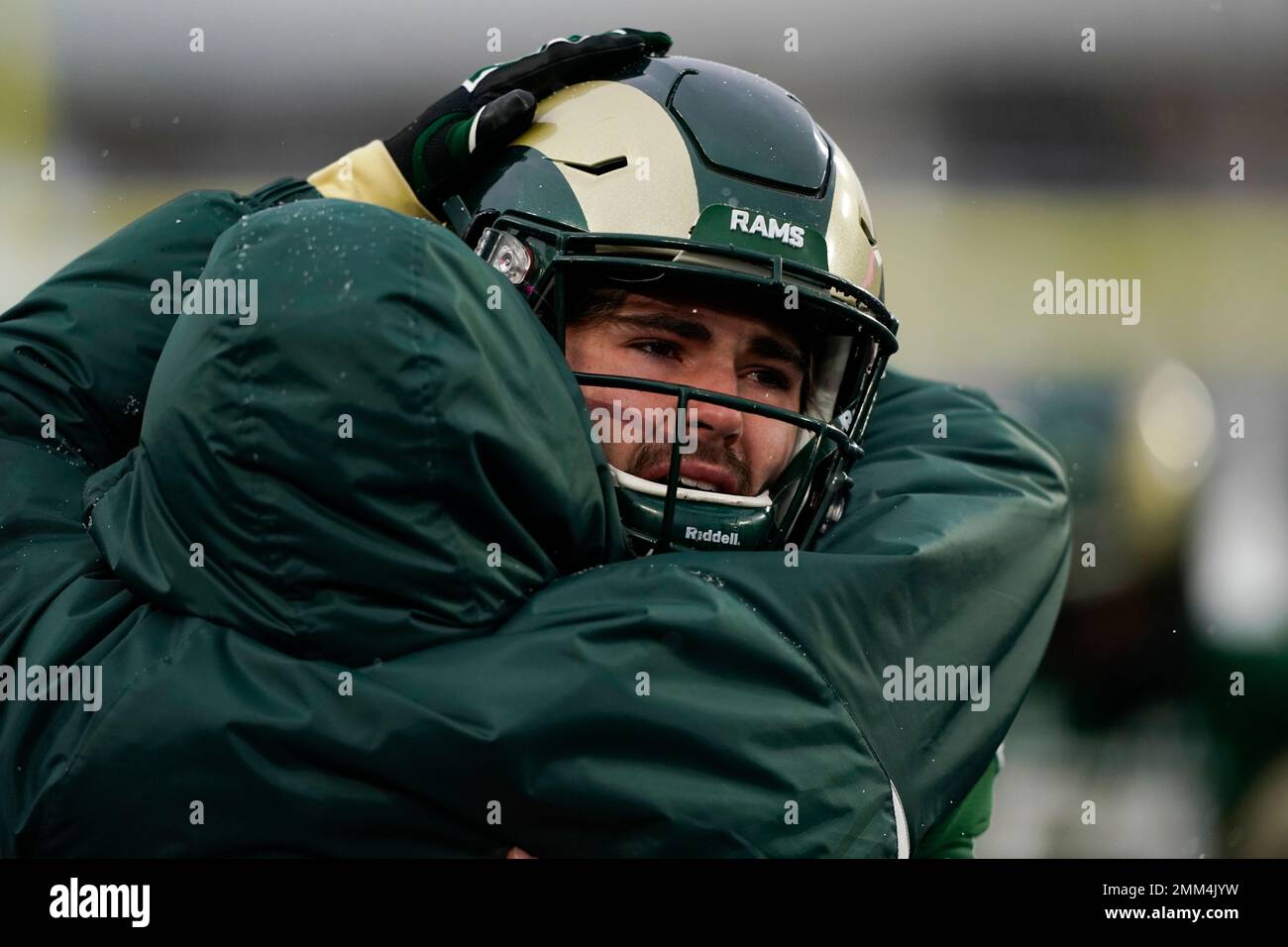 Colorado State quarterback Collin Hill is consoled after the team's 29 ...