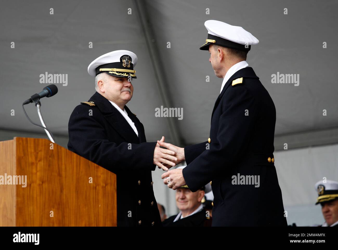 U.S. Navy commander Randy Malone, left, commanding officer of the USS ...