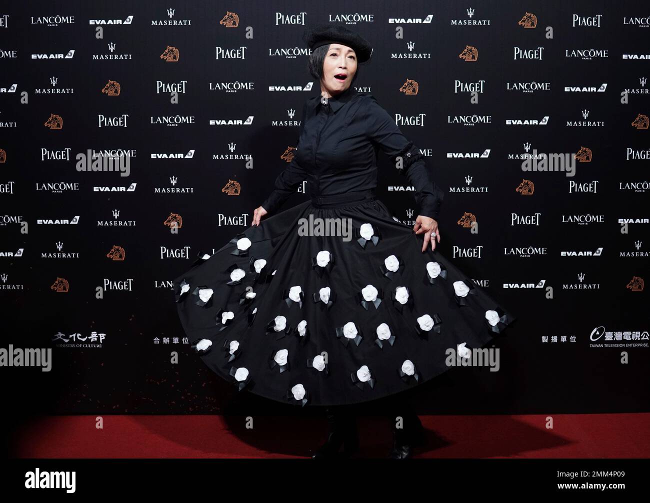 Hong Kong actress Kingdom Yuen poses on the red carpet at the 55th ...