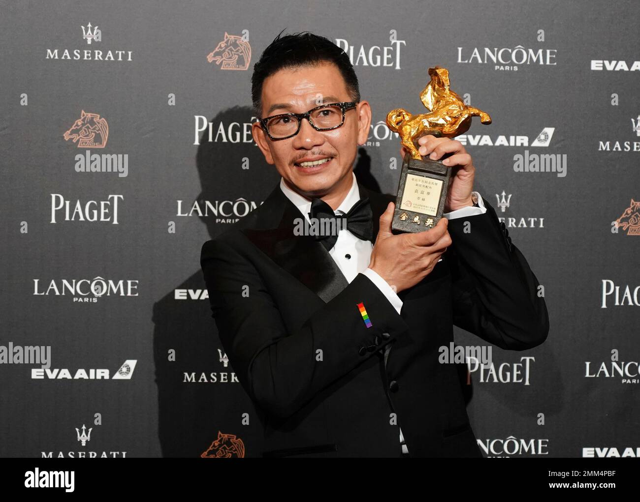 Hong Kong actor Ben Yuen holds his award for Best Supporting Actor at ...