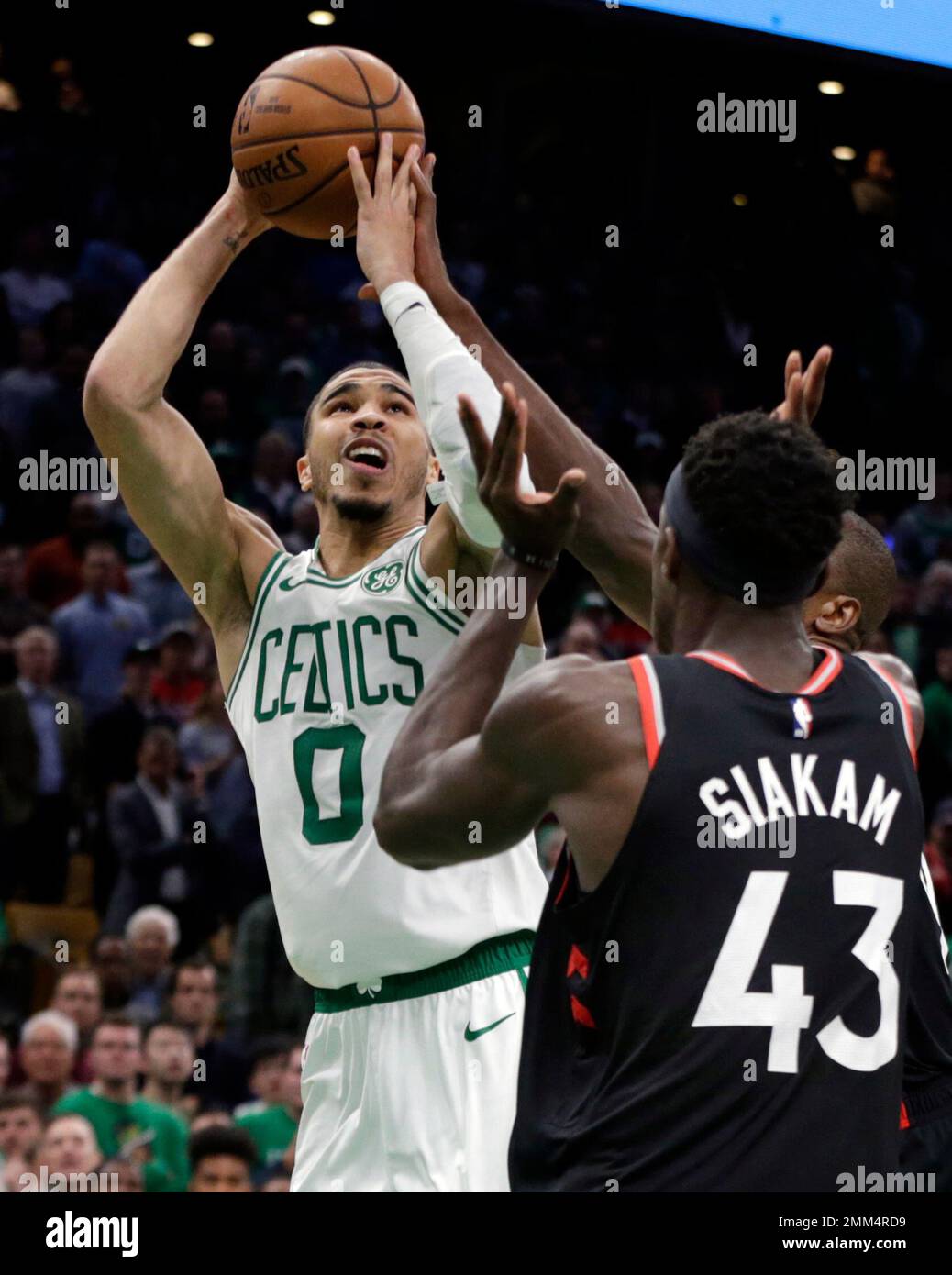 Boston Celtics forward Jayson Tatum (0) goes up to score against Toronto Raptors forward Pascal ...