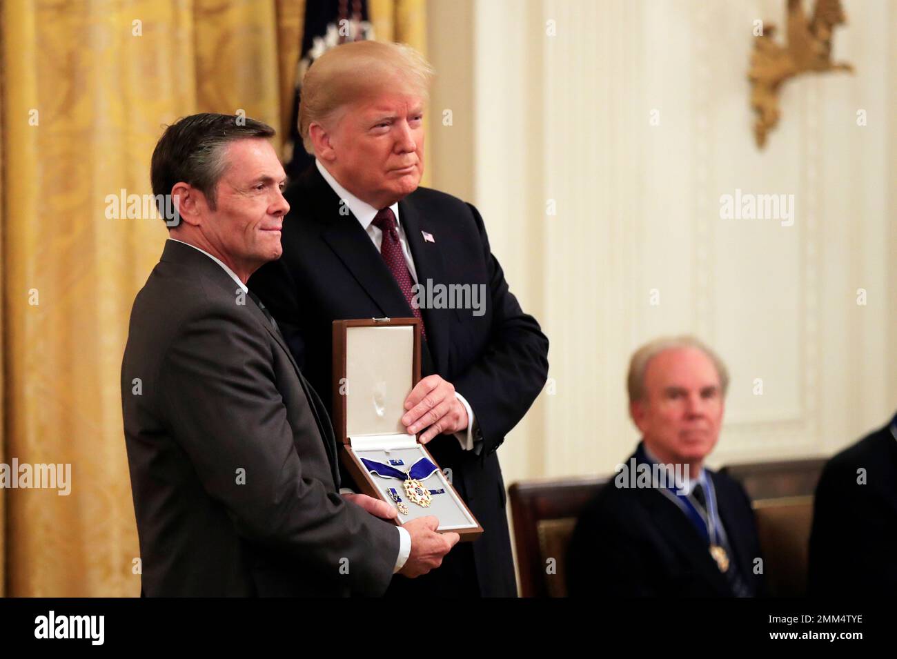 Thomas Stevens, grandson of Babe Ruth, accepts the Presidential Medal of Freedom on behalf of ...