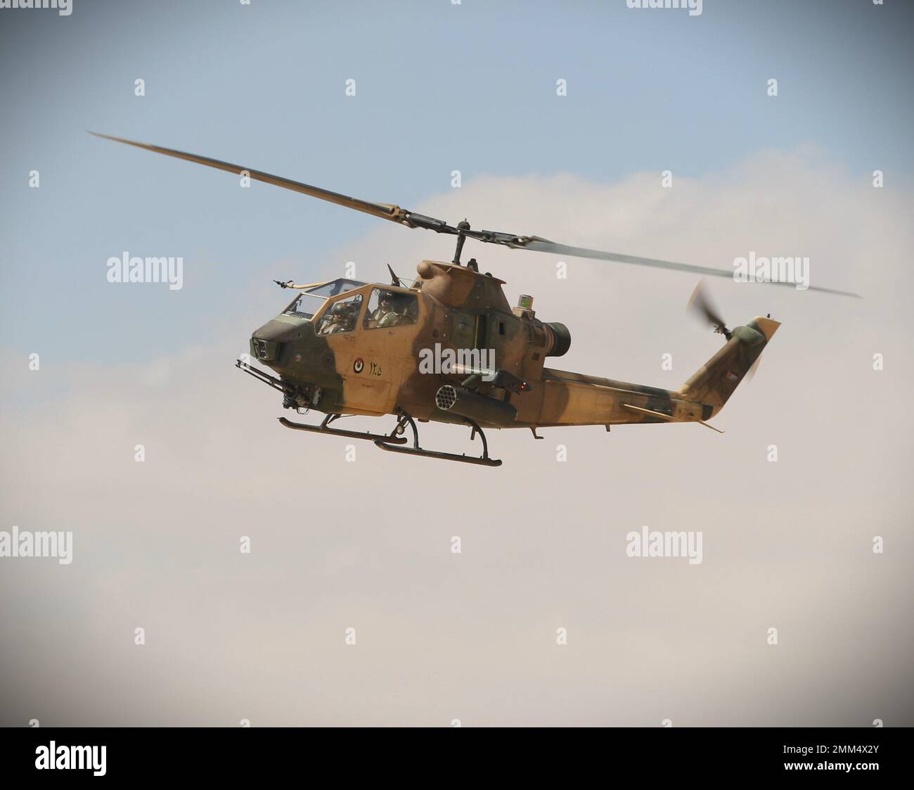 A Jordanian Armed Forces Bell AH-1 Cobra helicopter maneuvers to ...