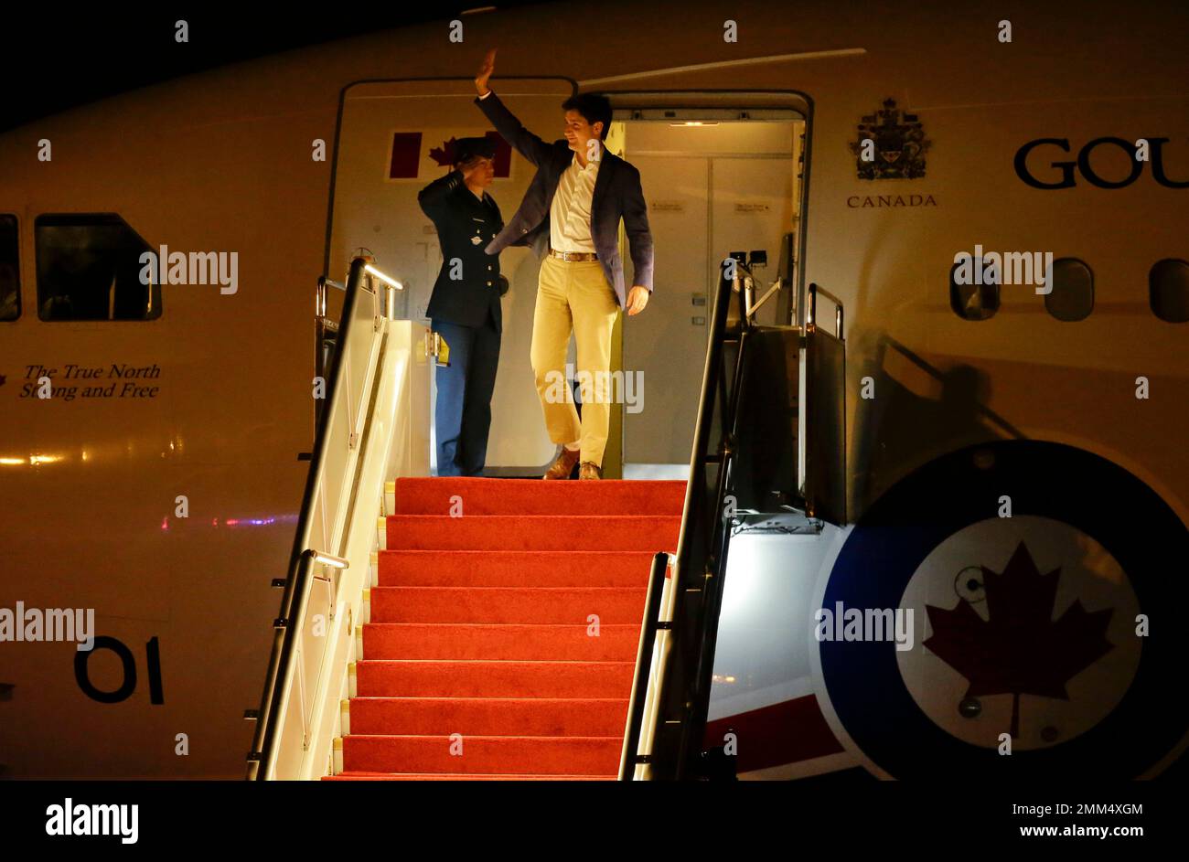 Canaddian Prime Minister Justin Trudeau waves upon arrival in Port ...