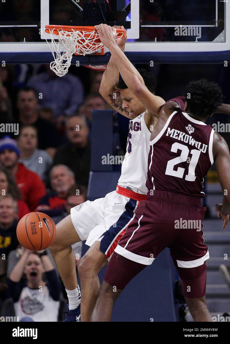 Gonzaga forward Brandon Clarke, left, dunks while defended by Texas A&M ...