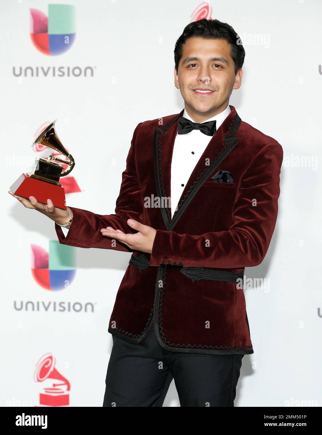 Christian Nodal poses in the press room with the award for best ...