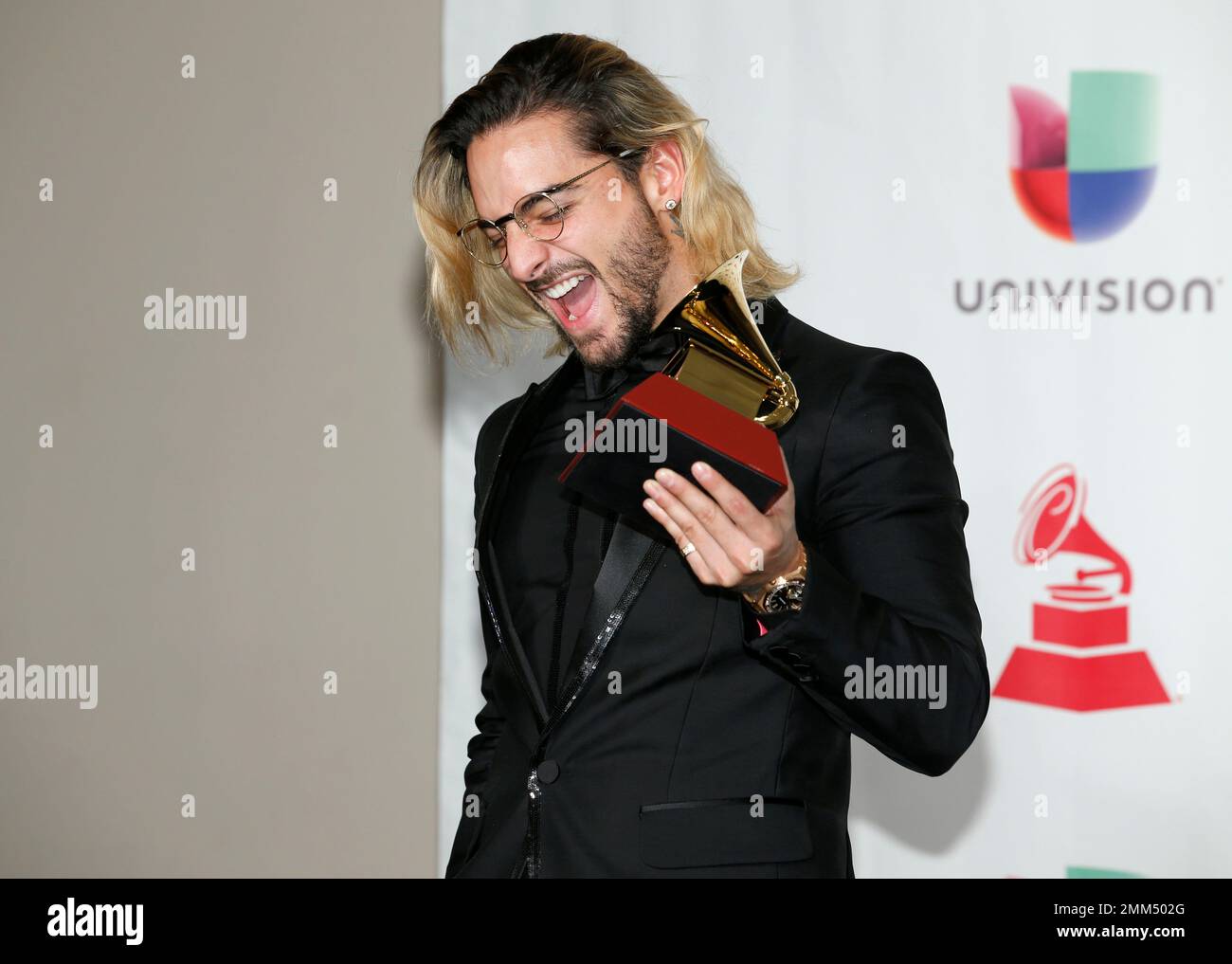 Maluma poses in the press room with the award for best contemporary pop ...