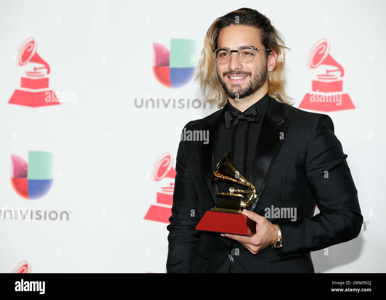 Maluma poses in the press room with the award for best contemporary pop ...