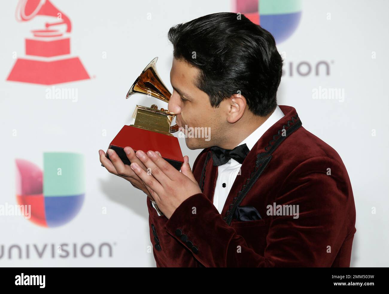 Christian Nodal poses in the press room with the award for best ...