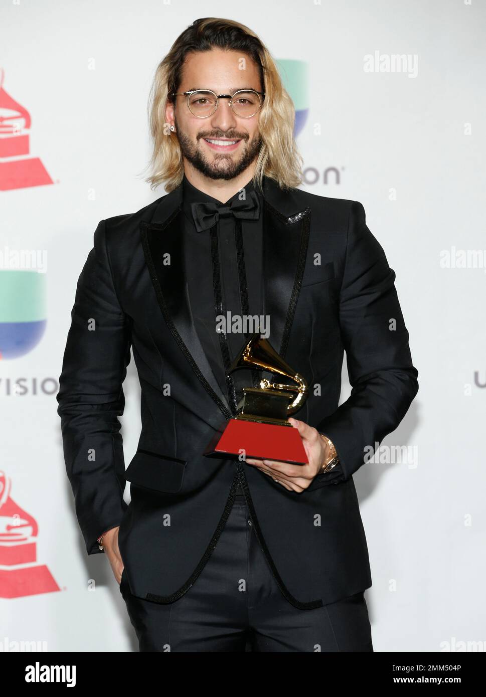 Maluma poses in the press room with the award for best contemporary pop ...