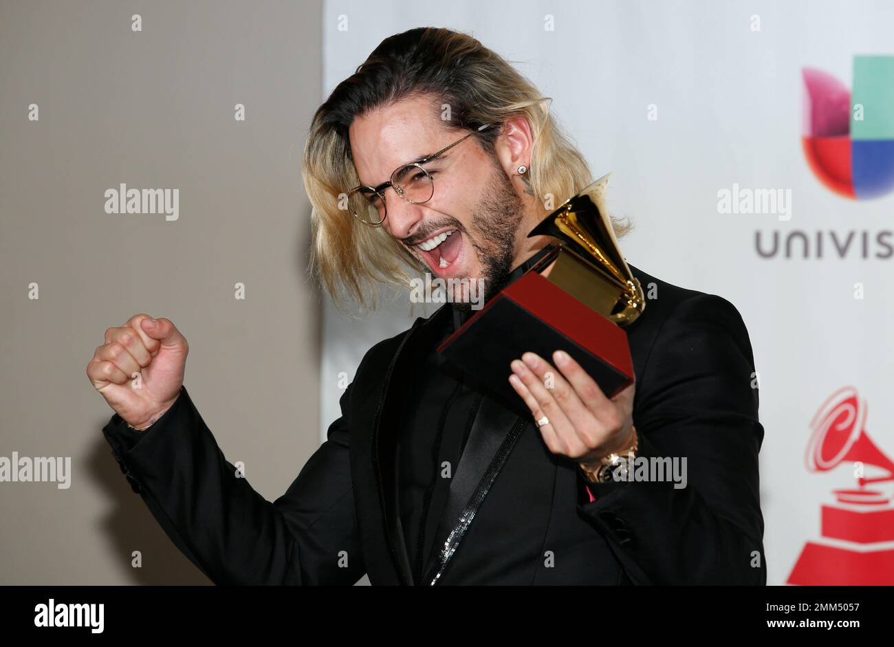 Maluma poses in the press room with the award for best contemporary pop ...