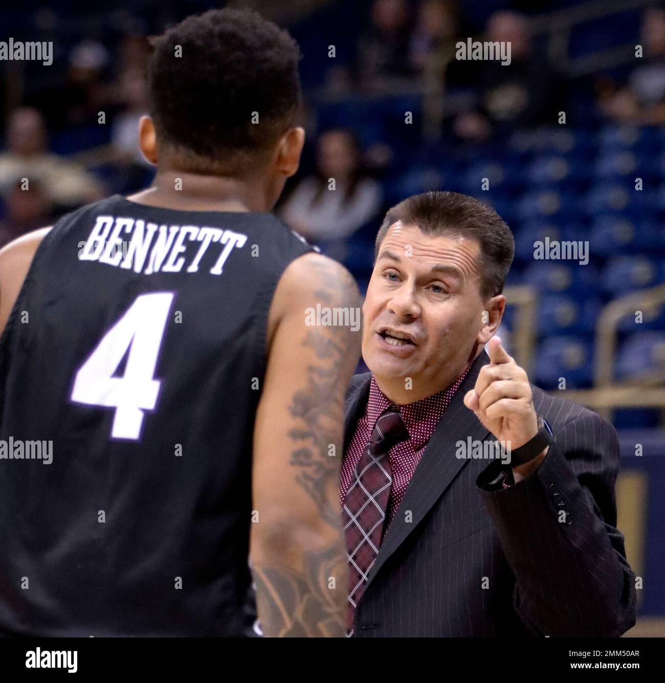 Central Arkansas coach Russ Pennell, right, talks with Khaleem Bennett ...