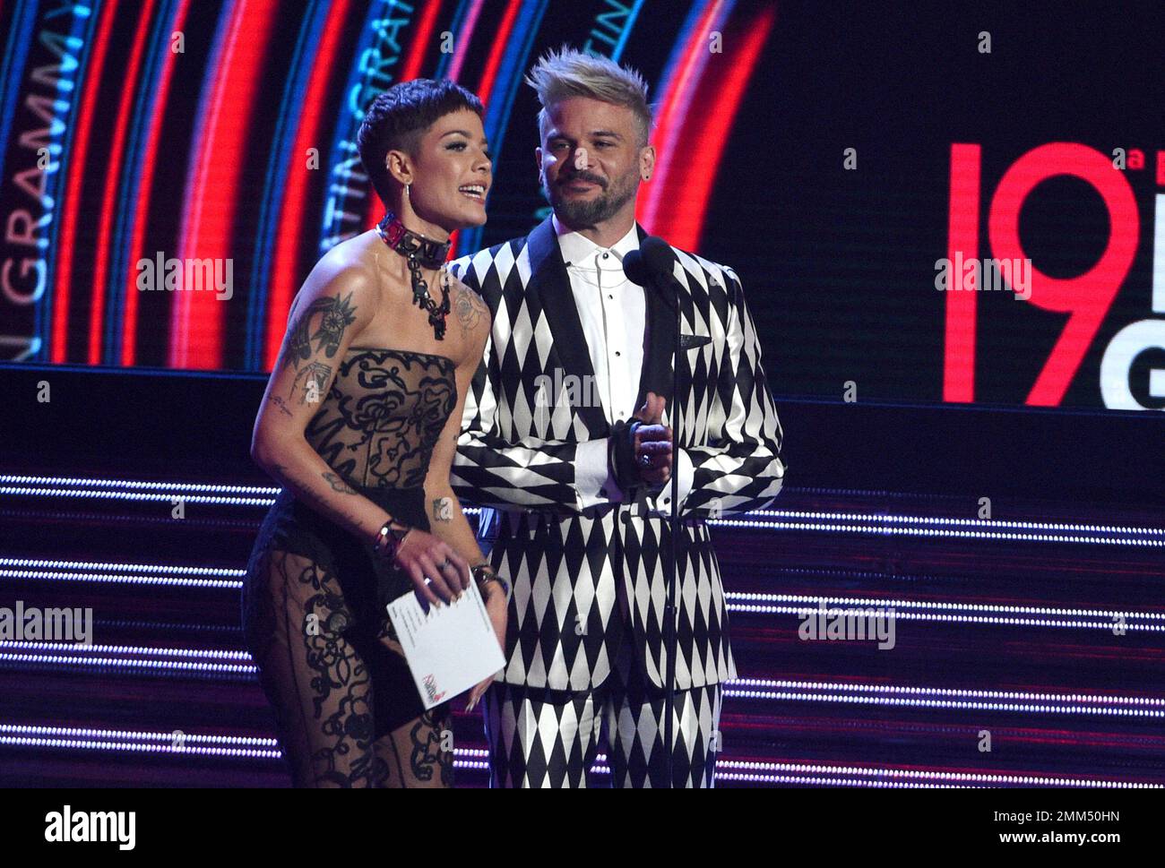 Halsey, left, and Pedro Capo present the award for best new artist at ...