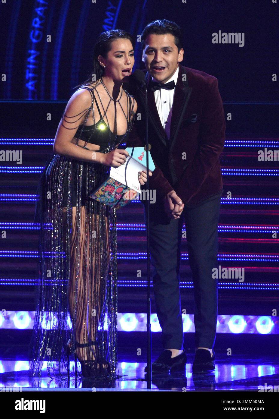 Lali, left, and Christian Nodal present the award for best traditional ...