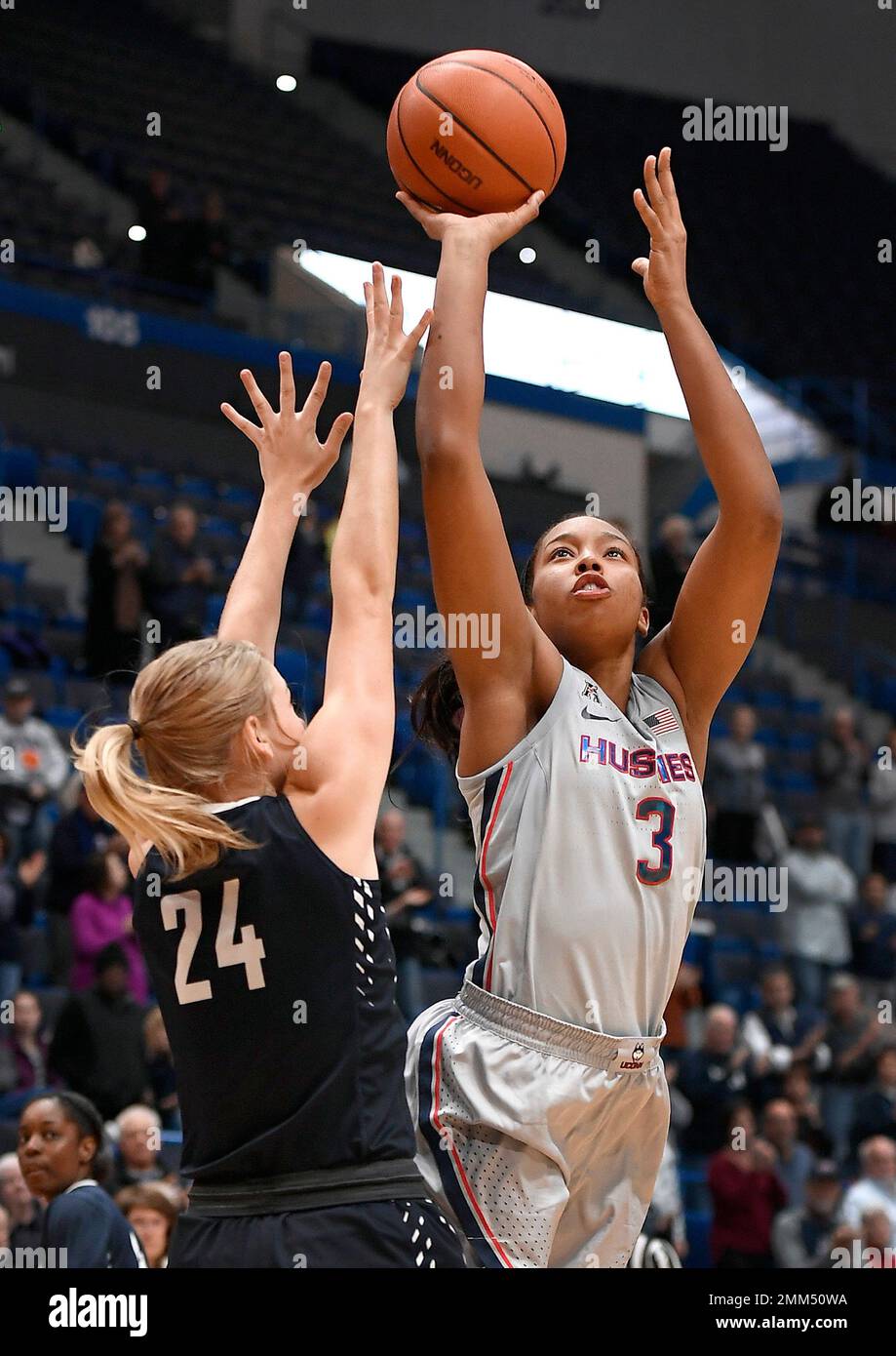 Connecticut's Megan Walker, right, shoots over Southern Connecticut ...