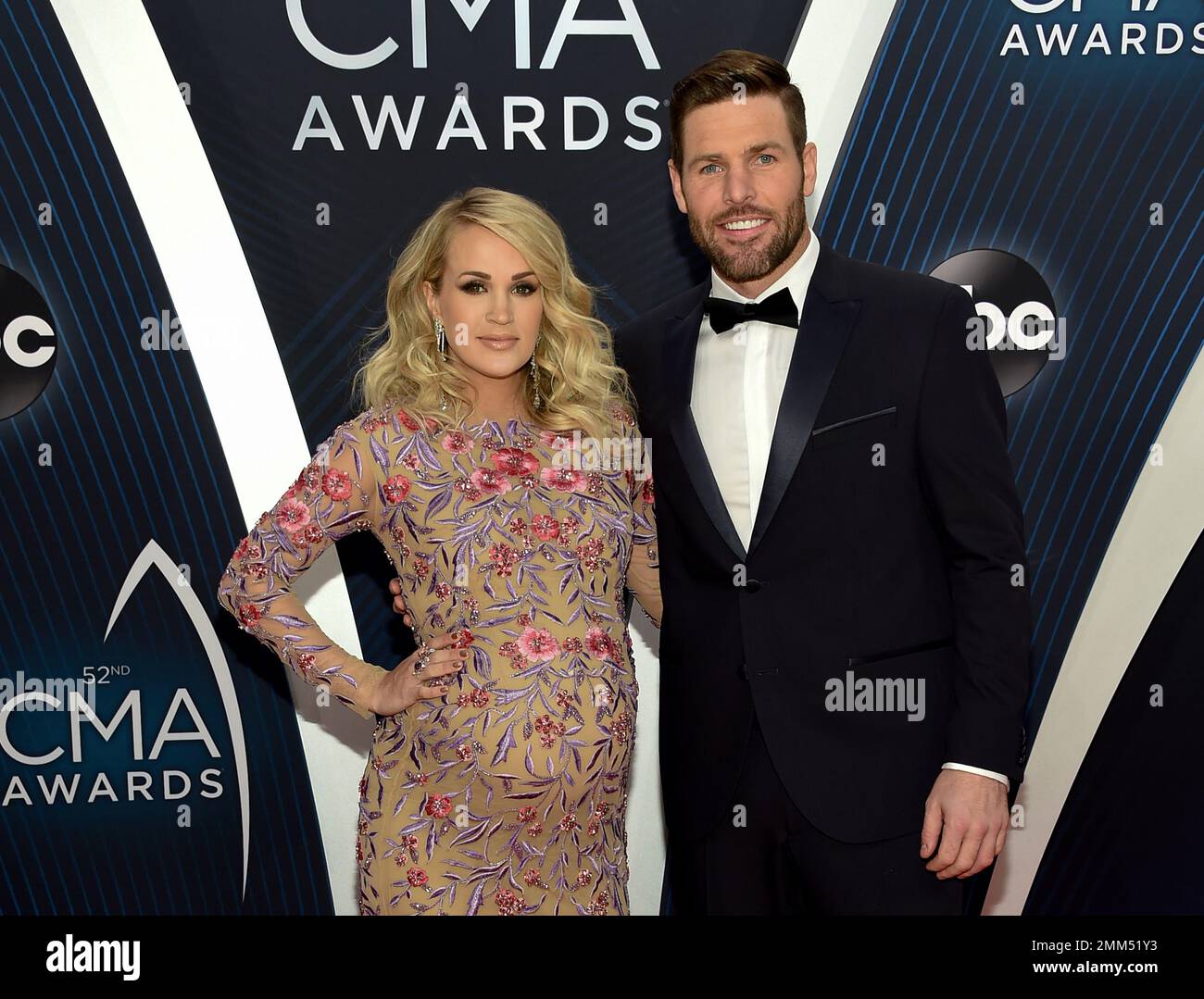 Singer Carrie Underwood and husband Mike Fisher arrive at the 52nd ...