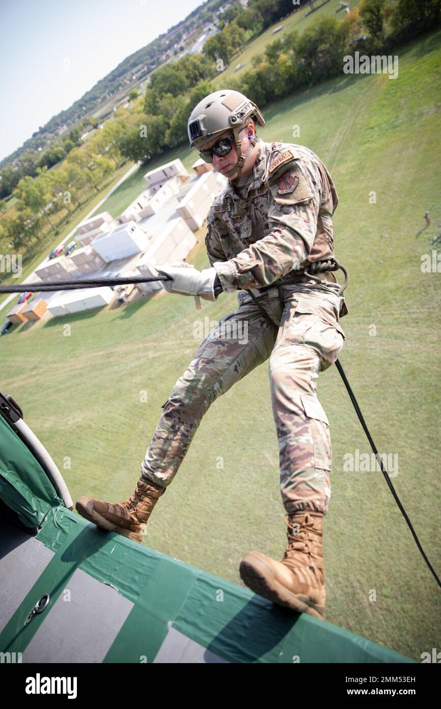 Airman 1st Class Luke Rudebeck, a cable and antenna defense operator ...