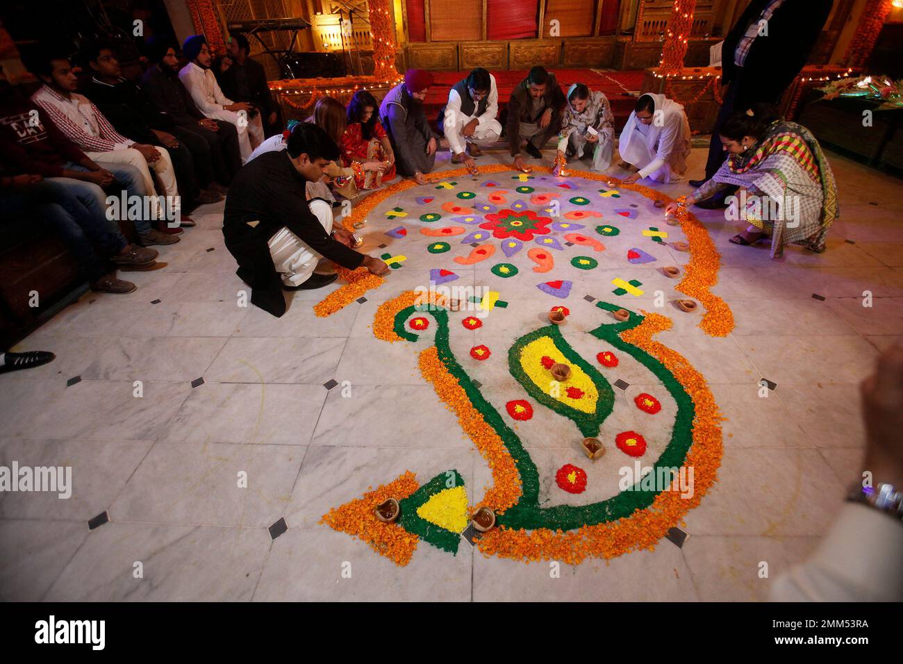 People celebrate the Diwali festival in Peshawar, Pakistan, Wednesday ...