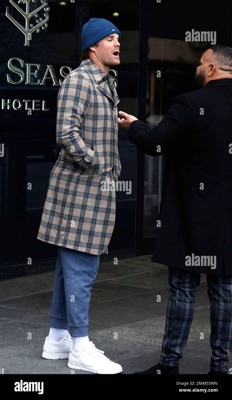 Greg Olsen outside talking to a friend at the Four Seasons Hotel ...