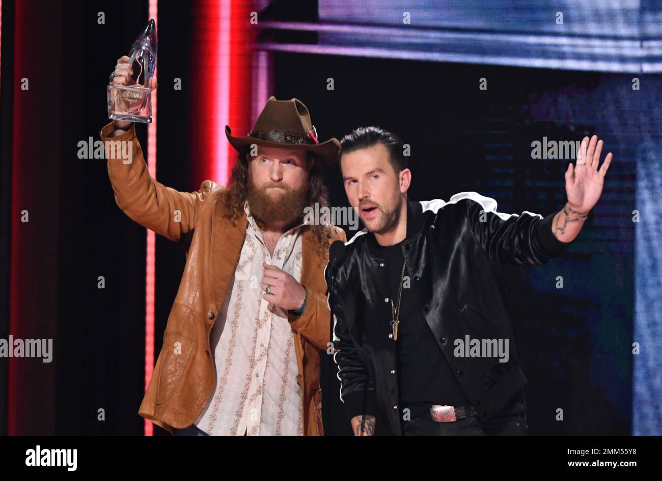 John Osborne, left, and T.J. Osborne of Brothers Osborne accept the ...